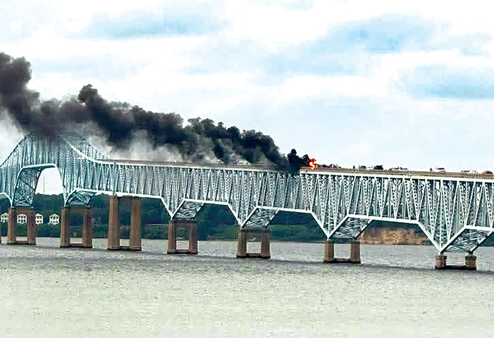 FIERY BRIDGE CRASH KILLS TWO • SSentinel.com